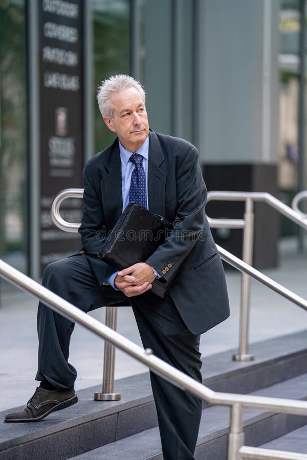 Handsome Businessman Posing in a Suit on a Staircase Stock Image ...