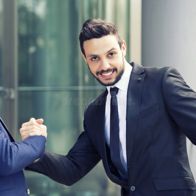 Handsome Businessman Shaking Hands with Someone Stock Photo - Image of ...