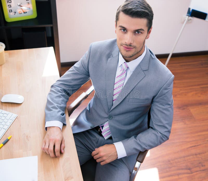 Handsome Businessman Sitting at the Table Stock Photo - Image of office ...