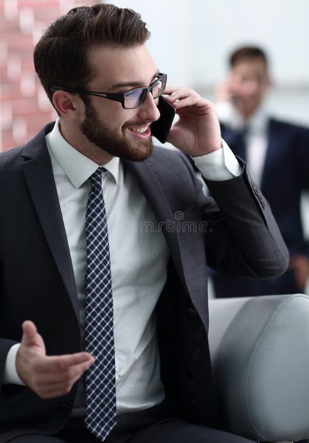 Handsome Businessman Speaking on Mobile Phone in Office Stock Image ...