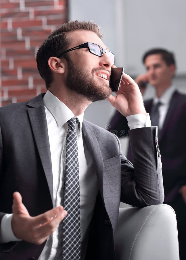Handsome Businessman Speaking on Mobile Phone in Office Stock Photo ...