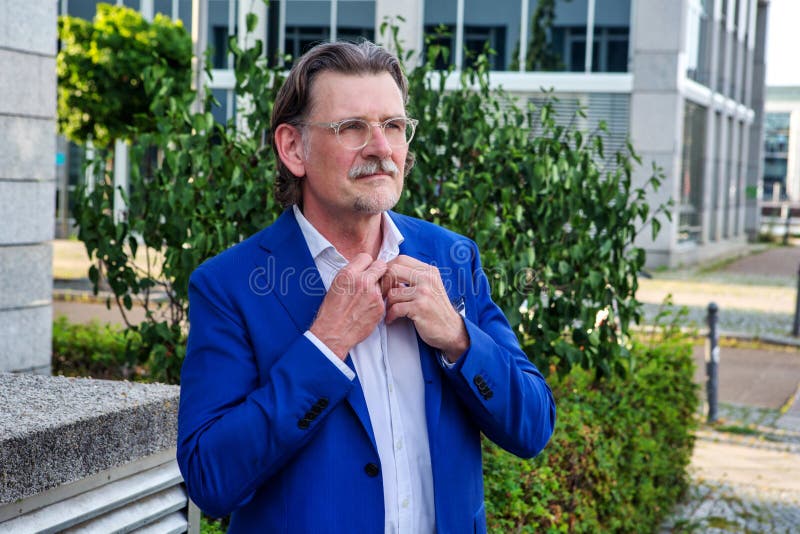 Handsome Businessman Standing Outside Fixing His Collar Stock Image ...