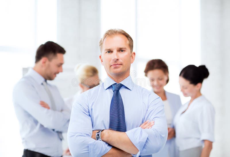 Handsome Businessman with Team in Office Stock Photo - Image of ...