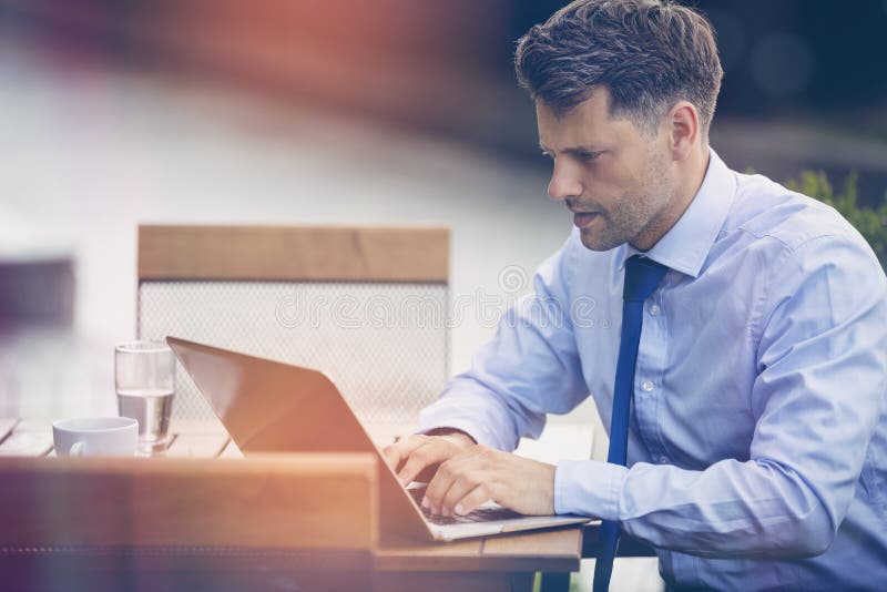 Handsome Businessman Using Laptop Stock Image - Image of dressed ...