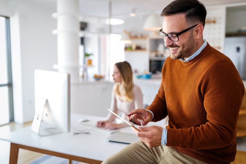 Handsome Businessman Using Tablet in Office. Technology, Business ...