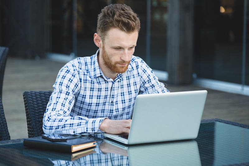 Remote Work. Young Man Working at Computer at Home Stock Photo - Image ...