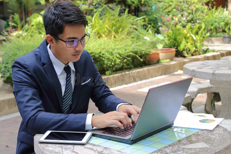 Handsome Businessman Working with Laptop Computer Outdoors in Park ...
