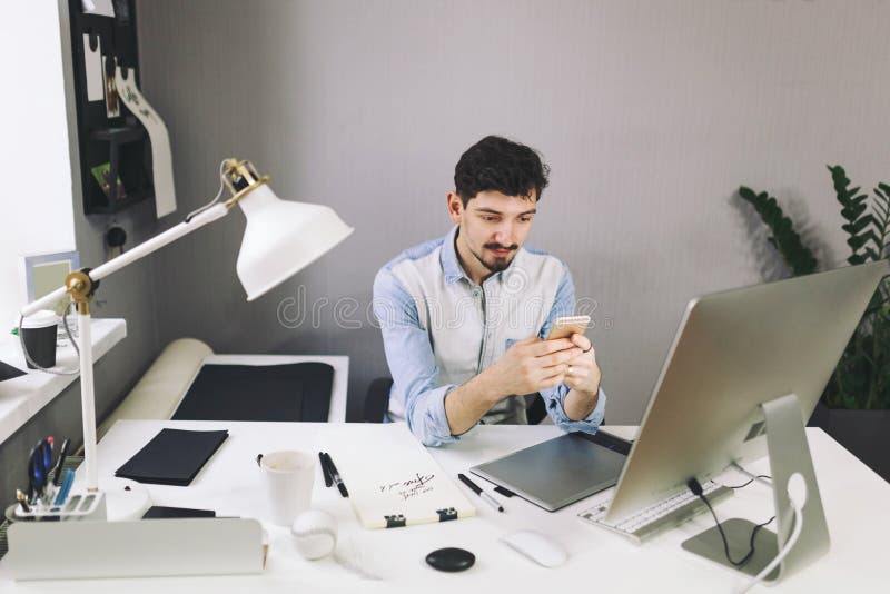 Handsome Businessman Working in Office Using Mobile Phone Stock Image ...