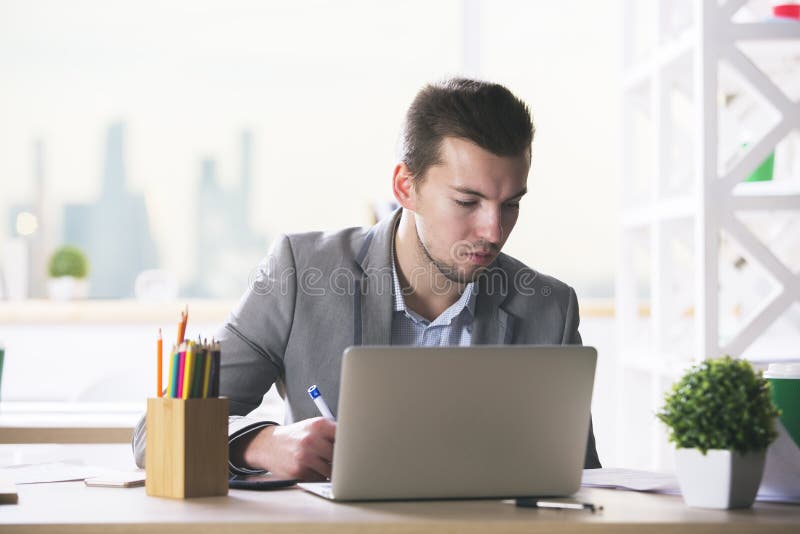 Handsome Businessman Working on Project Stock Photo - Image of gadget ...