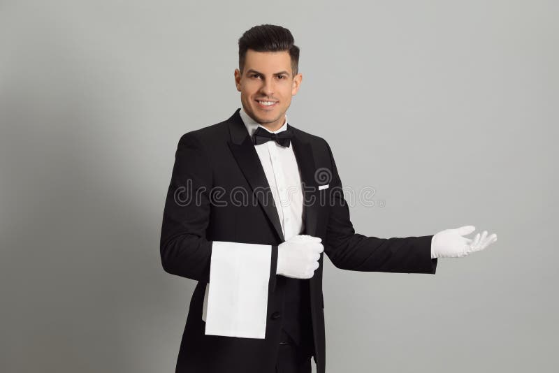 Handsome Butler in Elegant Uniform on Grey Background Stock Image ...