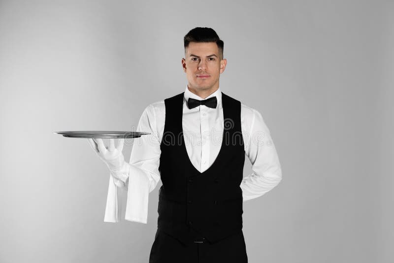 Handsome Butler with Tray on Light Grey Background Stock Photo - Image ...