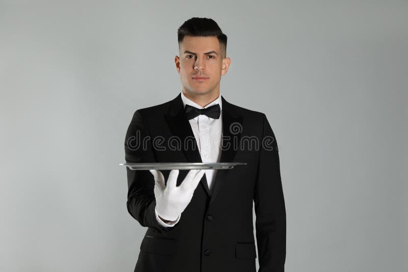 Handsome Butler with Tray on Light Grey Background Stock Photo - Image ...