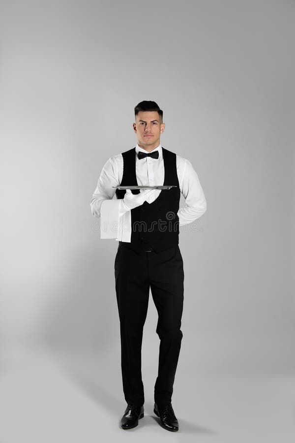 Handsome Butler with Tray on Light Grey Background Stock Image - Image ...