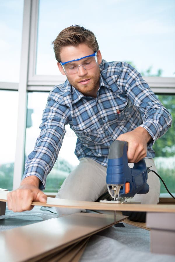 Handsome Carpenter Cutting Wood at Site Stock Photo - Image of sawing ...
