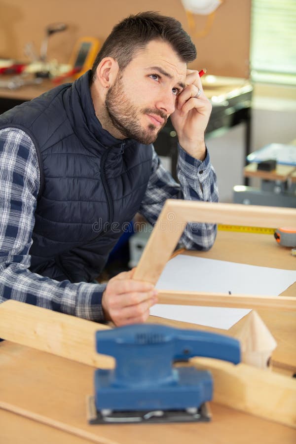 Handsome Carpenter Planning Work in Workshop Stock Image - Image of ...