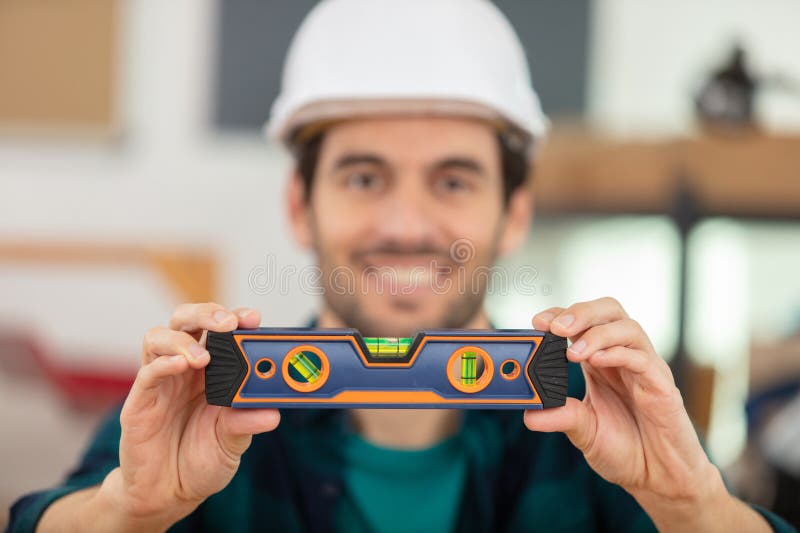 Handsome Carpenter Showing Spirit Level Stock Image - Image of handy ...