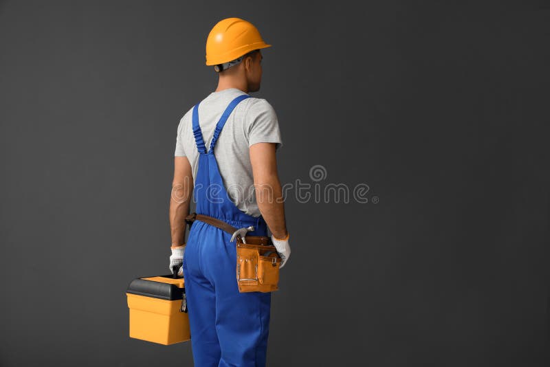 Handsome Carpenter with Tool Box on Background. Space for Text Stock ...