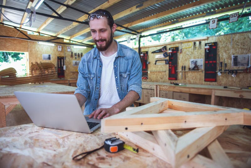 Handsome carpenter working stock image. Image of design - 287769981