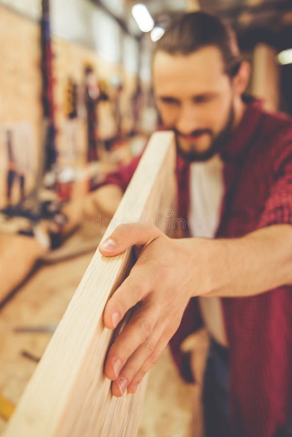 Handsome carpenter working stock image. Image of casual - 76913991