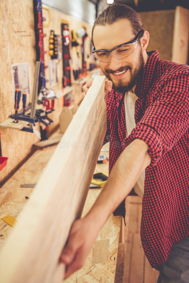 Handsome carpenter working stock image. Image of design - 76913515