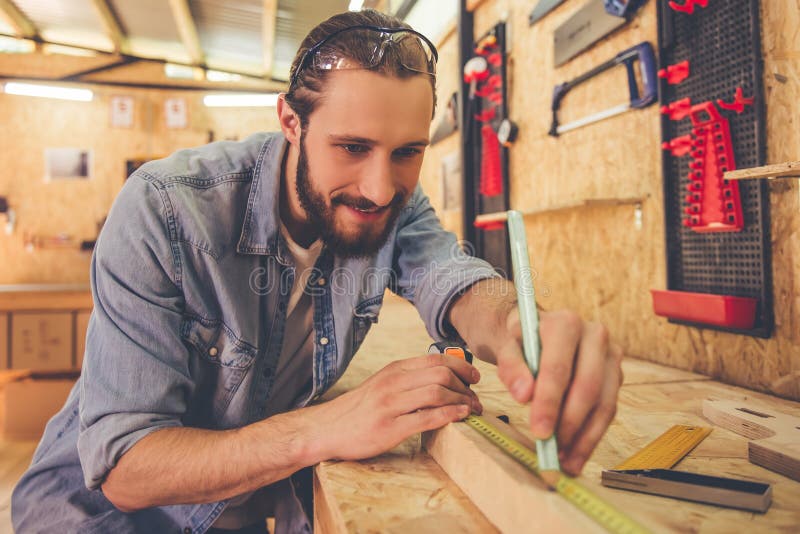 Handsome carpenter working stock photo. Image of carpentry - 76913390