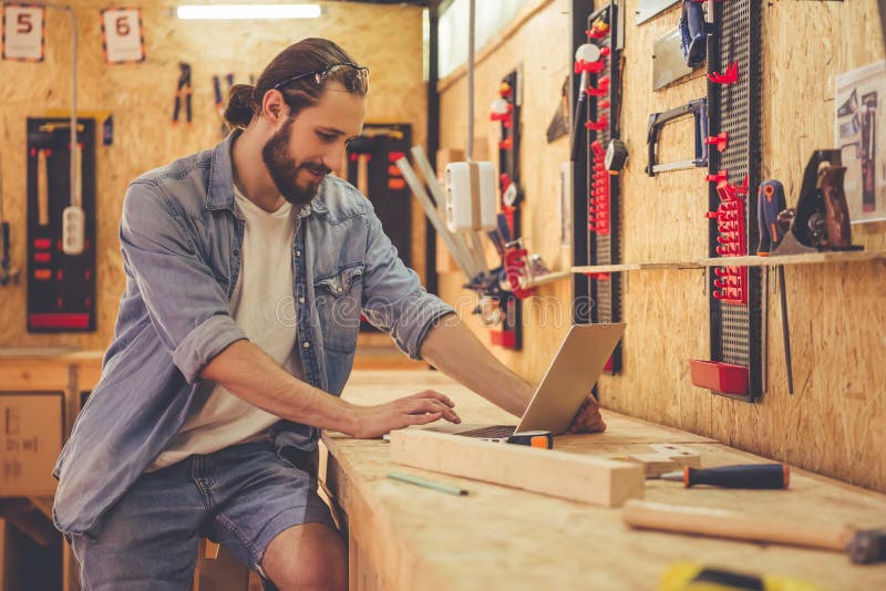 Handsome carpenter working stock image. Image of hammer - 76913483