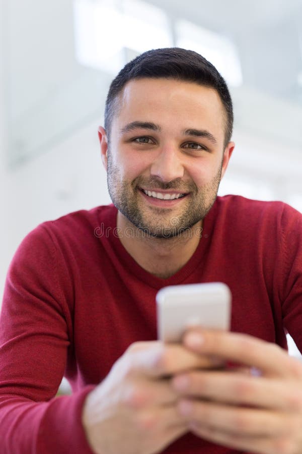 Young Man Using a Mobile Phone at Home Stock Image - Image of mobile ...