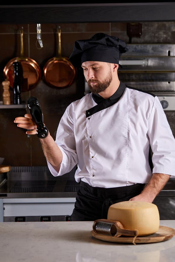 Handsome Caucasian Chef in Apron and Cap Hold Rolling Pin in Hands ...