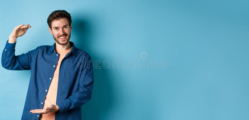 Handsome Caucasian Guy Showing Something Big, Shaping Large Size Object ...