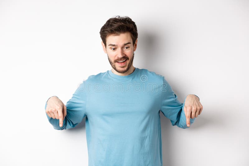 Handsome Caucasian Man Pointing Down with Impressed and Happy Face ...