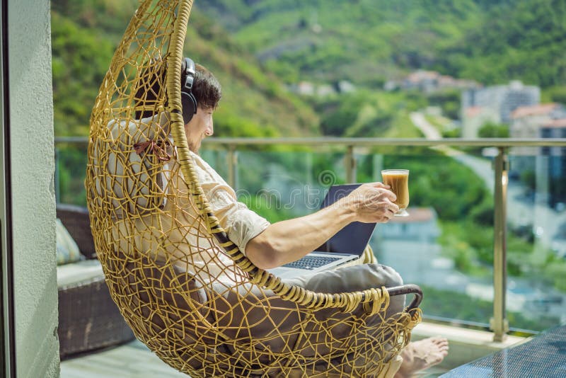 Handsome Caucasian Man Sitting on the Terrace Working from Home Using ...