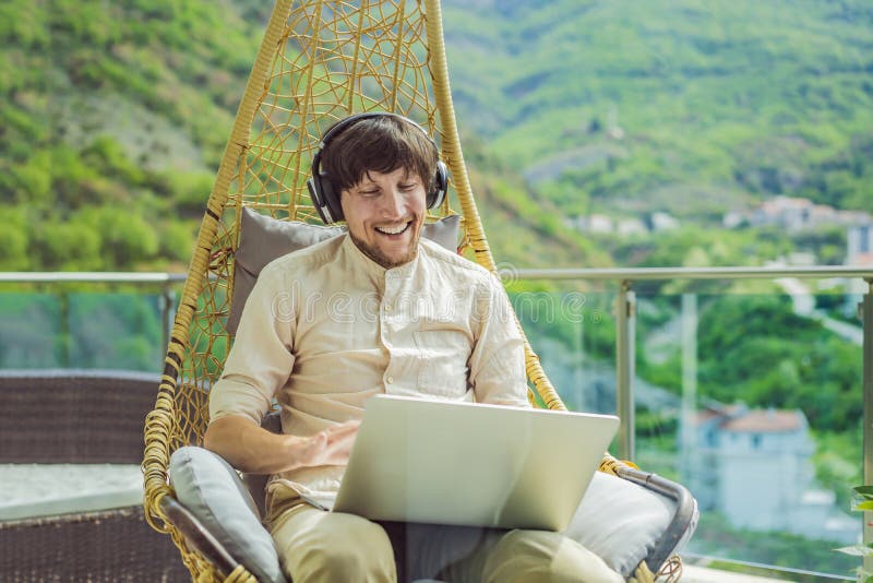 Handsome Caucasian Man Sitting on the Terrace Working from Home Using ...