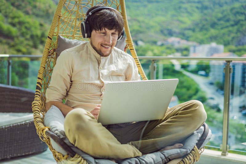 Handsome Caucasian Man Sitting on the Terrace Working from Home Using ...