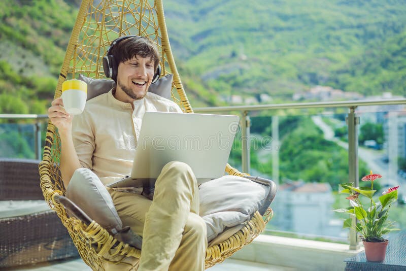 Handsome Caucasian Man Sitting on the Terrace Working from Home Using ...