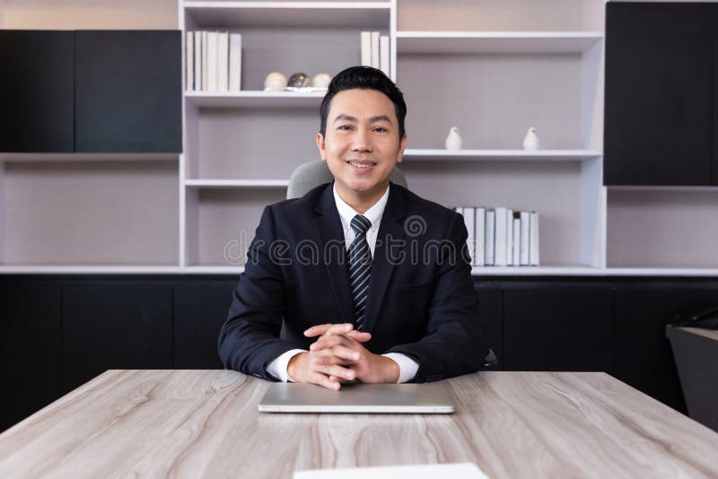 Handsome Cheerful Asian Man Executive Business Man at the Workspace ...