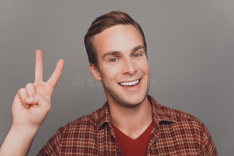 Handsome Cheerful Man Gesturing with Two Fingers Stock Image - Image of ...