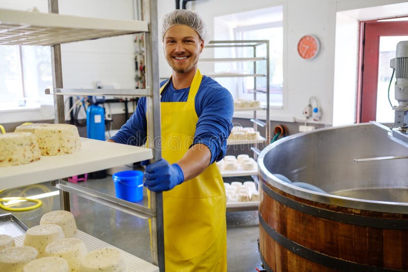 Handsome Cheesemaker Making Curd Cheese in His Factory Stock Photo ...