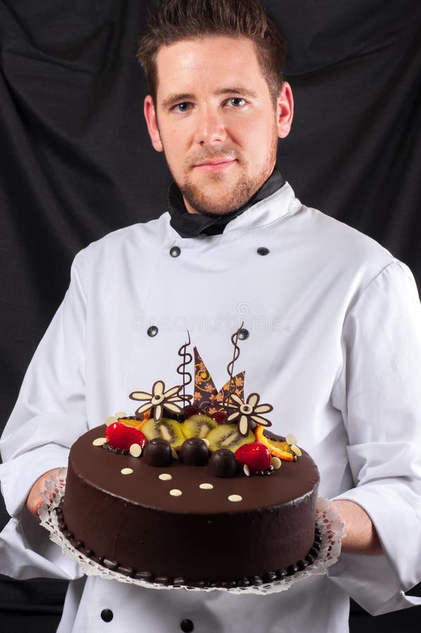 Handsome chef with cake stock photo. Image of gift, cook - 25349646