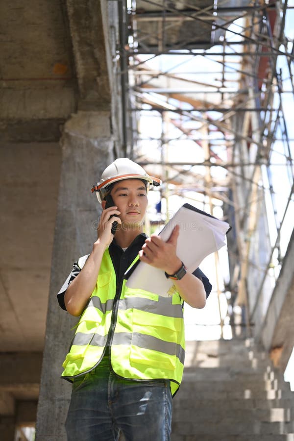 Handsome Civil Engineer Manager Standing at Construction Site and ...
