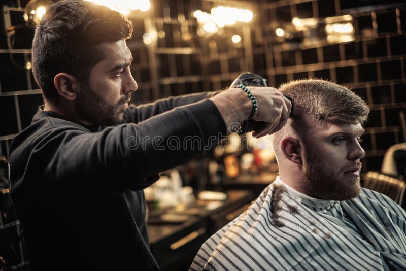 Clients in barbershop stock photo. Image of masculinity - 134321102