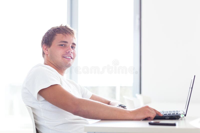 Handsome College Student with Laptop Computer in University Library ...