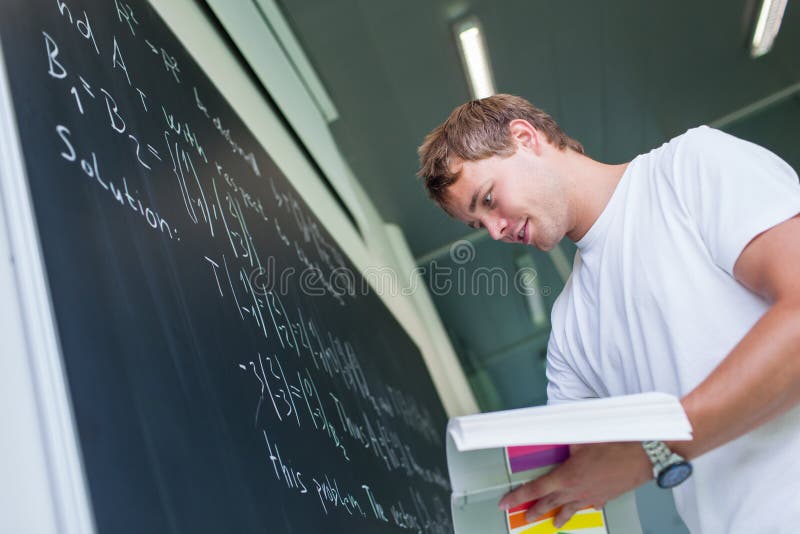 Handsome College Student Solving a Math Problem during Math Class Stock ...
