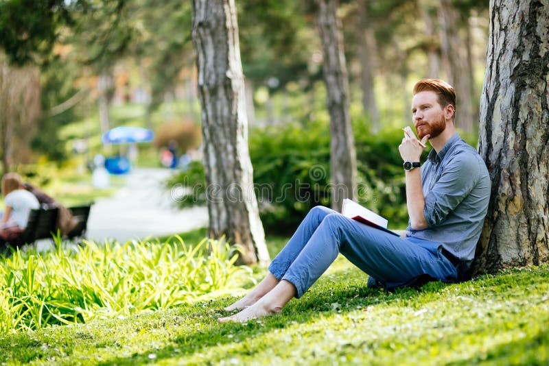 College Student Studying in Park Stock Image - Image of outdoors ...
