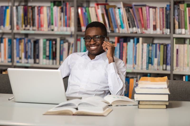 Handsome College Student Using Mobile Phone in Library Stock Image ...