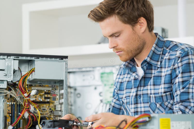 Handsome Computer Engineer Repairing Faulty Pc Stock Photo - Image of ...