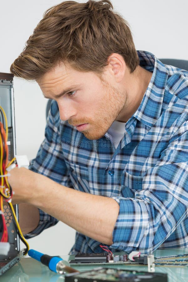 Handsome Computer Engineer Repairing Faulty Pc Stock Photo - Image of ...
