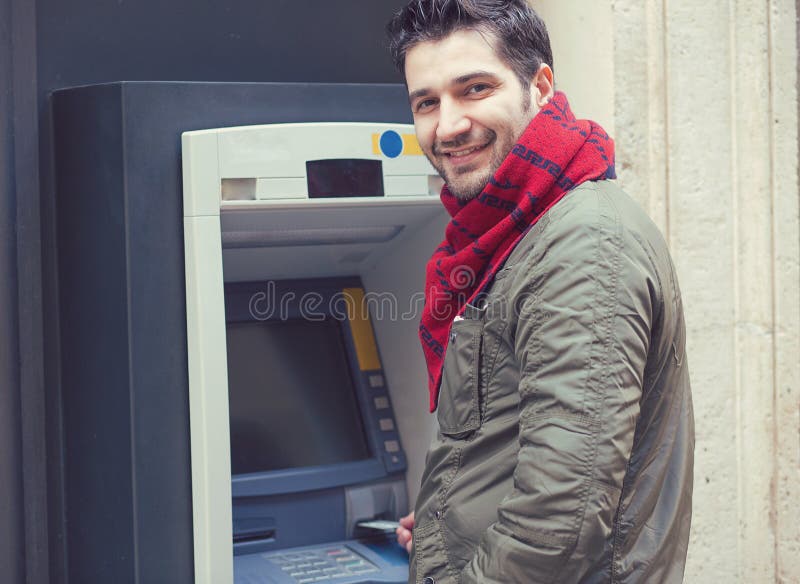 Content Man Using ATM Machine Outside Stock Photo - Image of customer ...