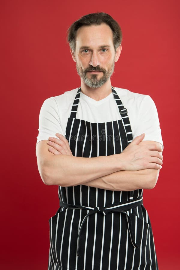 Handsome and Confident. Mature Person in Cooking Apron. Bearded Mature ... Handsome and Confident. Mature Person in Cooking Apron. Bearded Mature ...