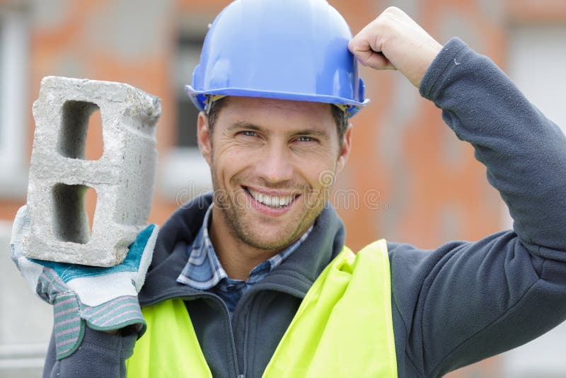 128 Construction Worker Carrying Concrete Block Stock Photos - Free ...