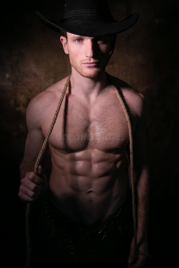 Handsome Cowboy Wearing a Hat with Barechest Showing Defined Pecs and ...